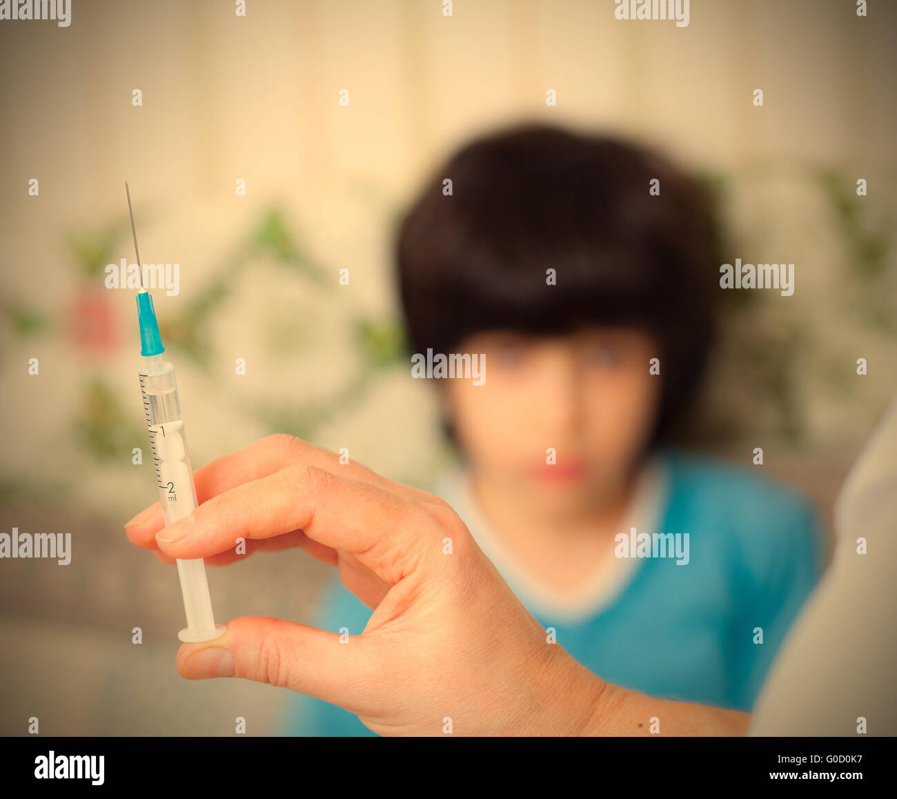 Doctor pediatrician with a syringe and a child in Stock Photo - Alamy