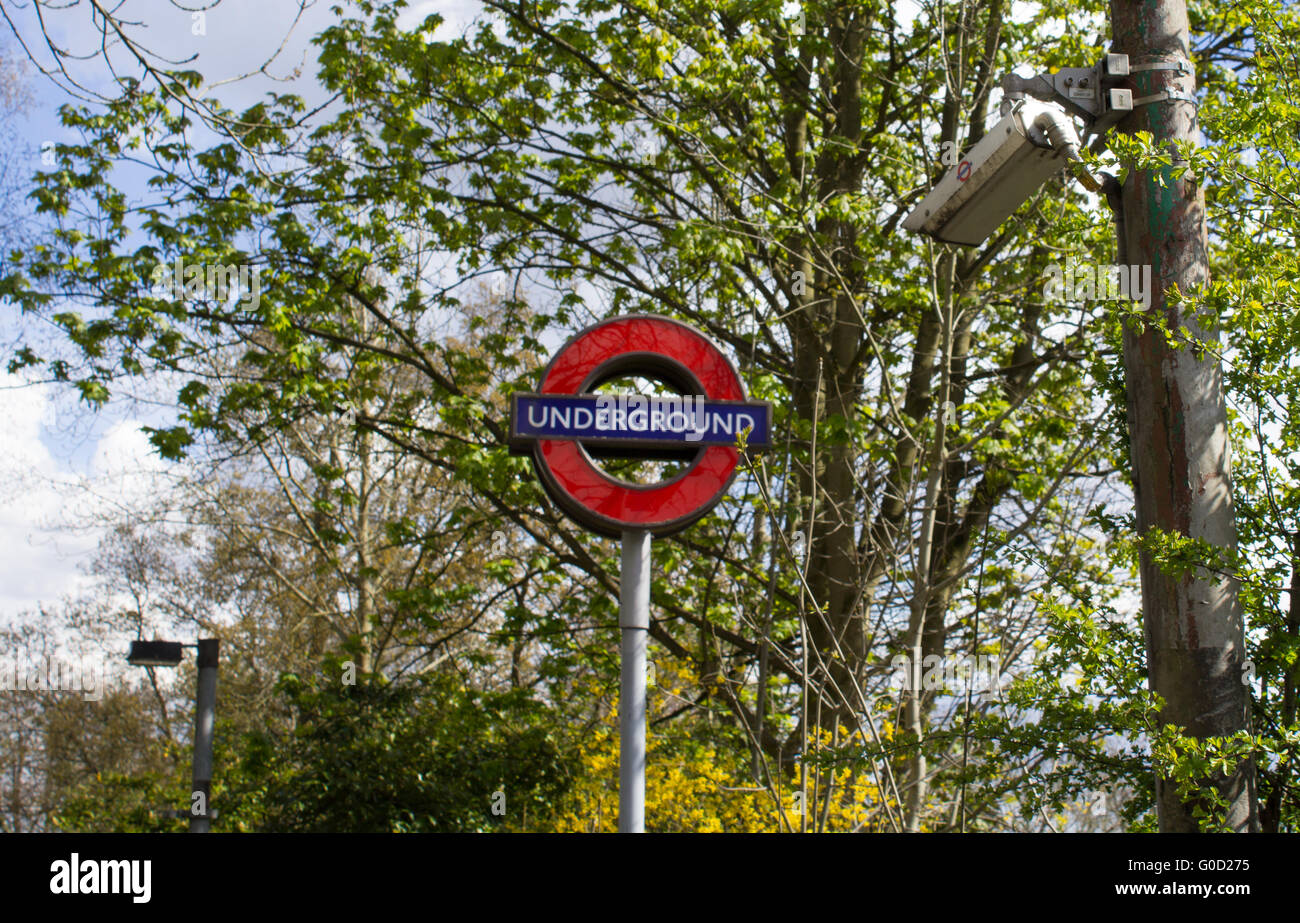 London Underground Tube sign and CCTV camera Stock Photo - Alamy