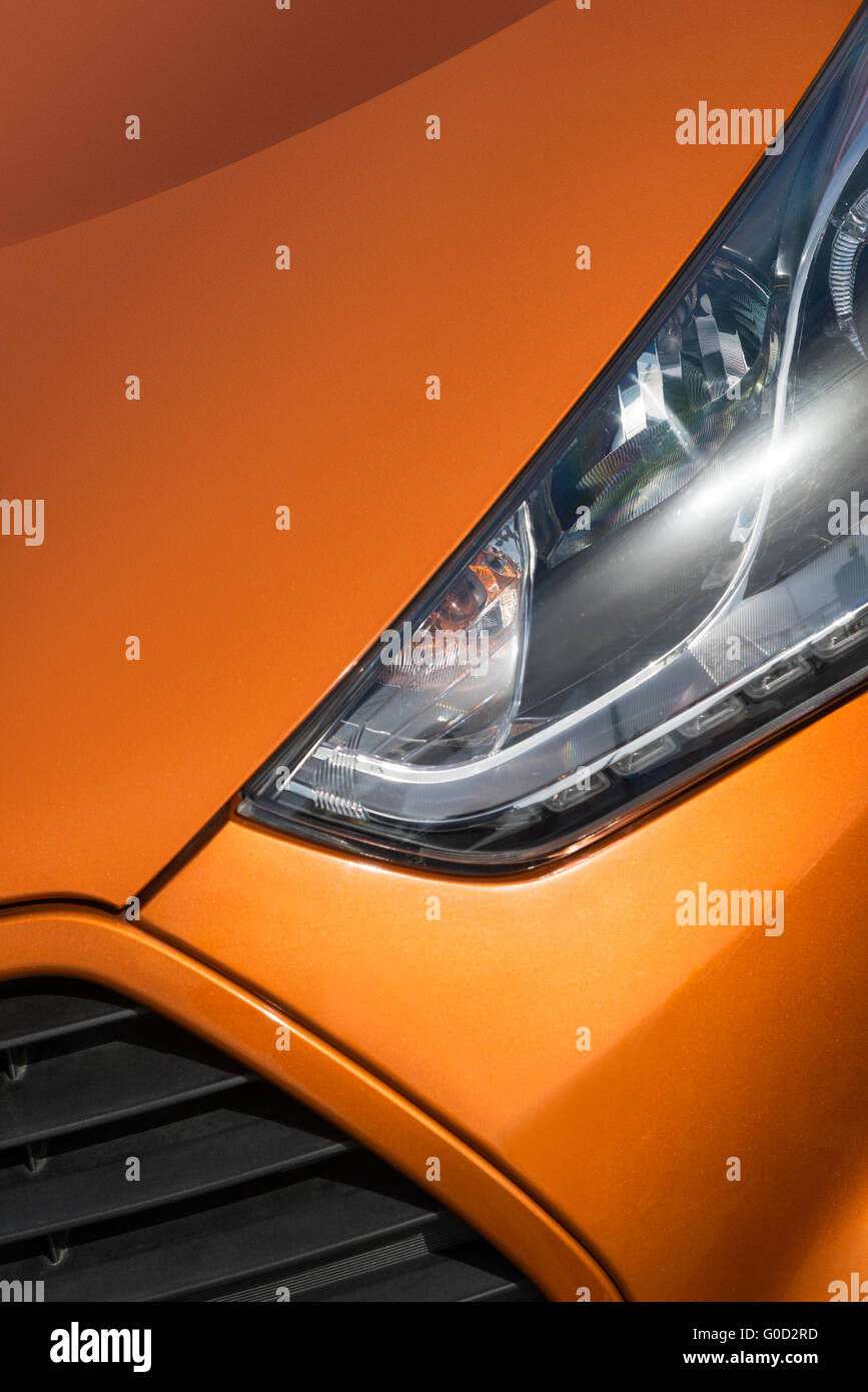 Orange sport car close-up Stock Photo - Alamy