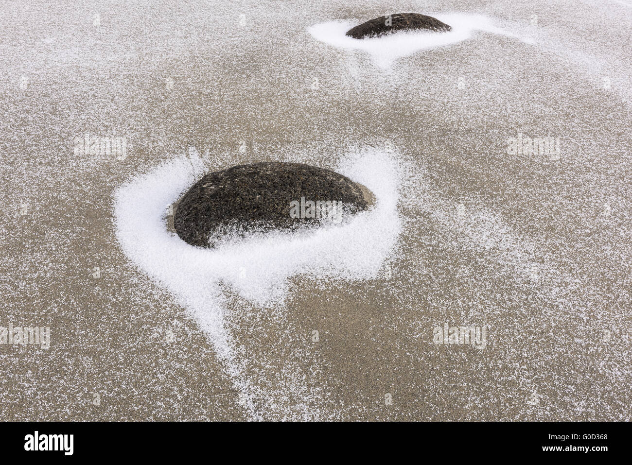 snowy stones on a sandy beach, Lofoten, Norway Stock Photo - Alamy