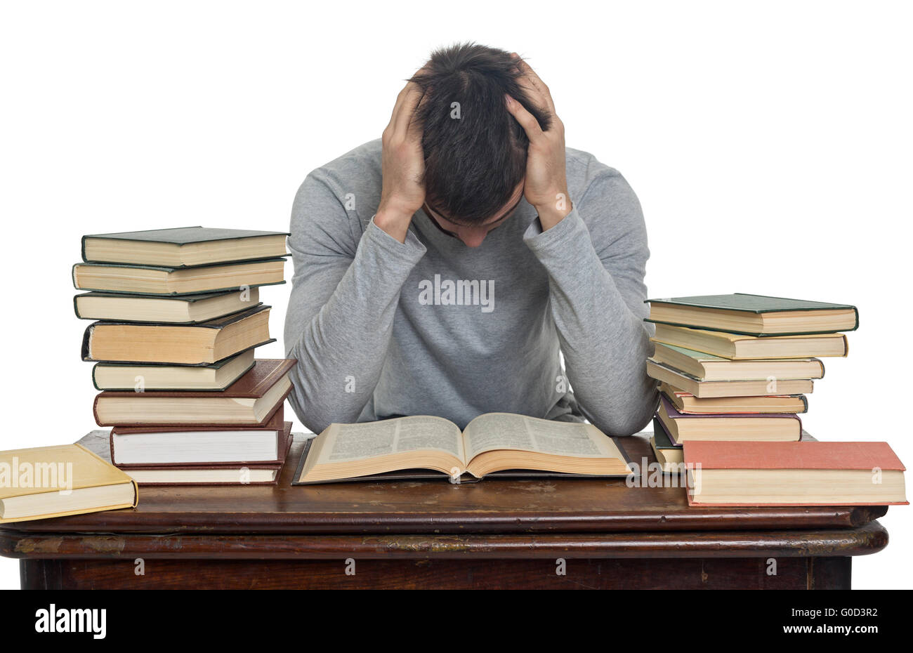 Young man sitting table studying hi-res stock photography and images ...