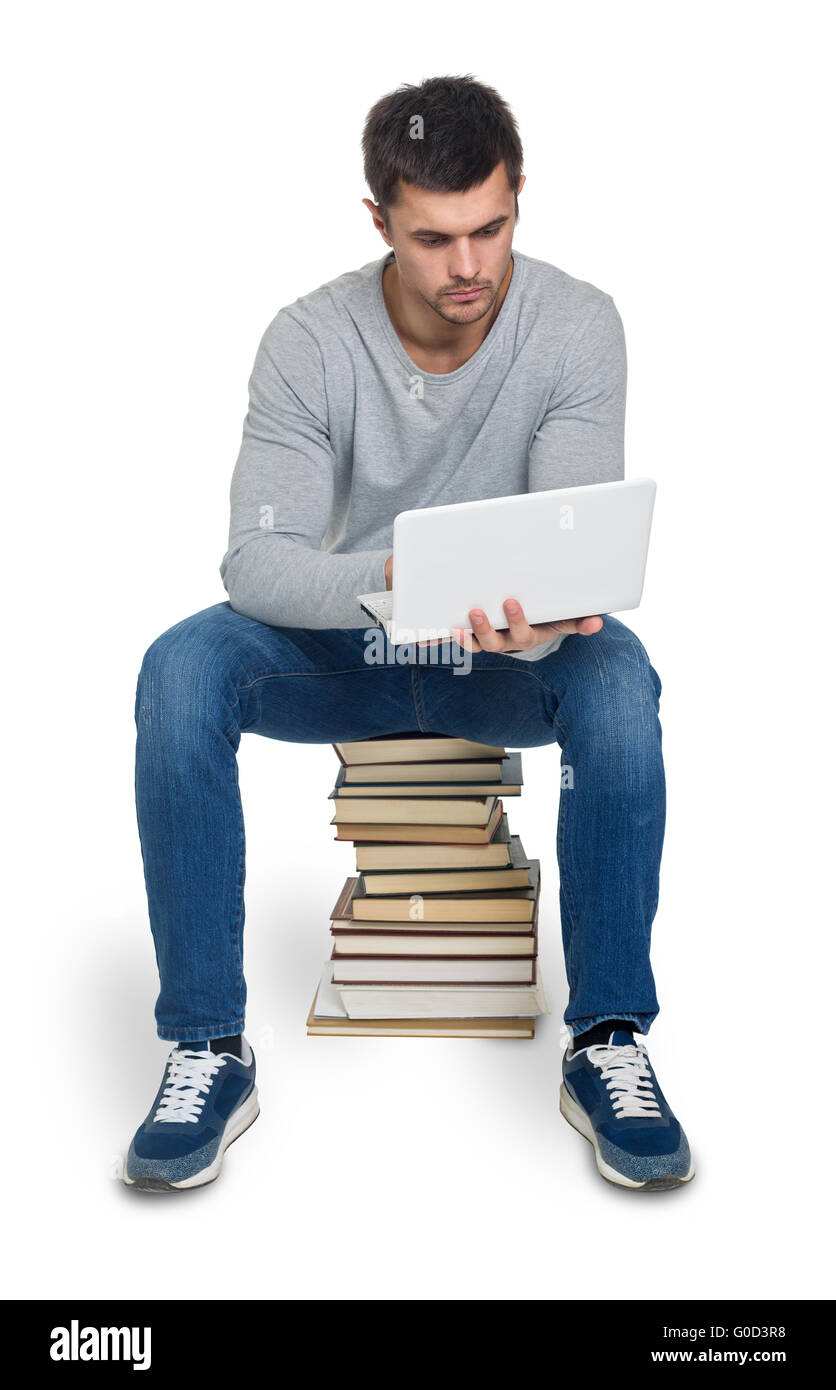 Man in library reading book Cut Out Stock Images & Pictures - Alamy