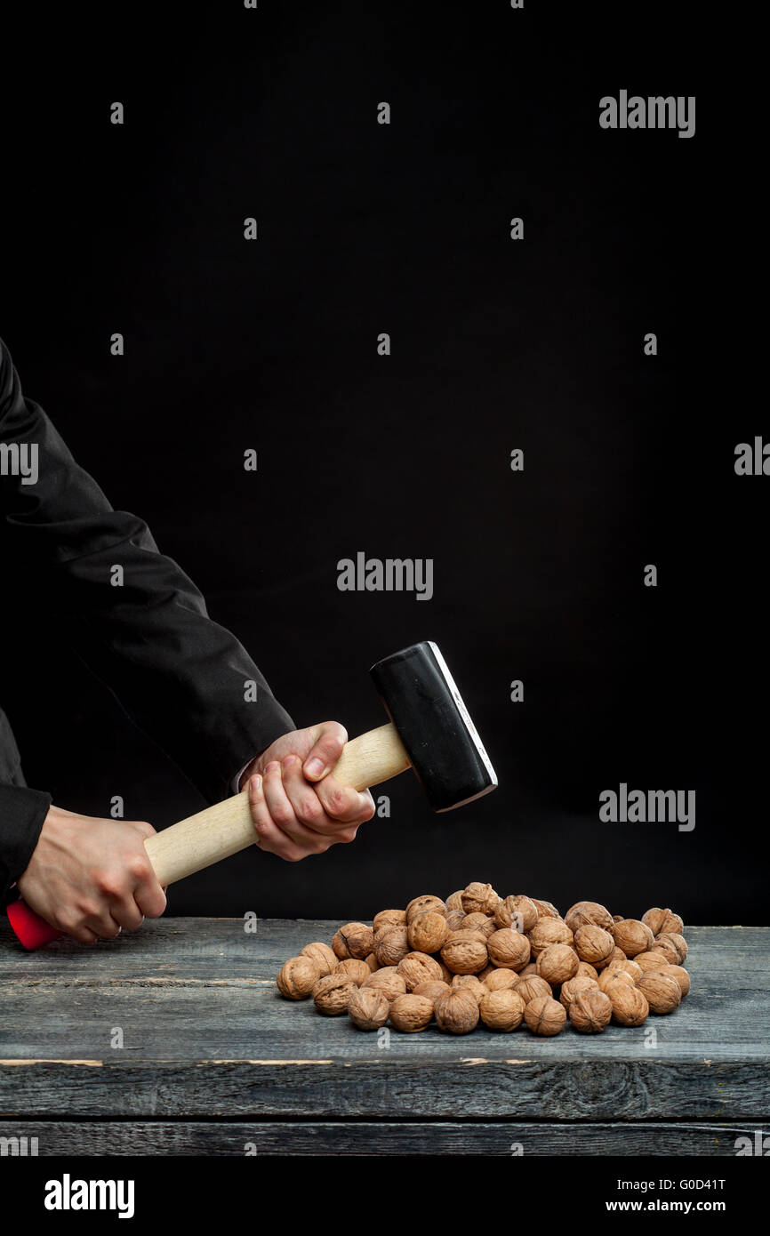 young man stabs a nut Stock Photo - Alamy