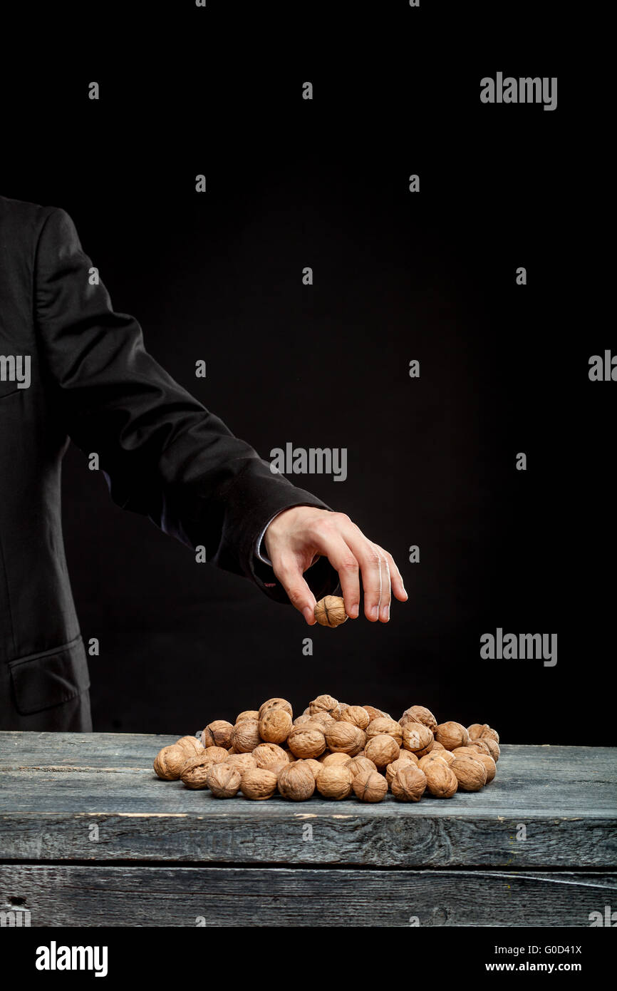 young man stabs a nut Stock Photo - Alamy