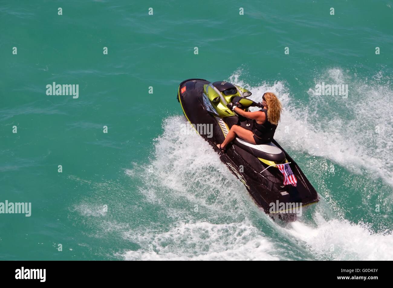 Woman riding jet ski hi-res stock photography and images - Alamy
