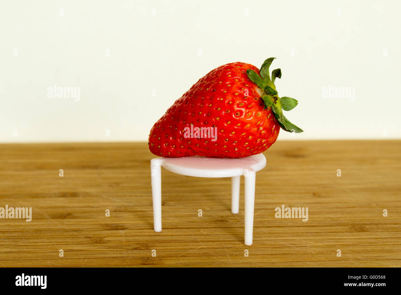 strawberry on a small table Stock Photo - Alamy