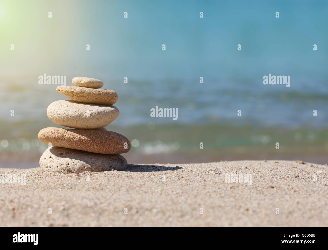 stack of stones on sand Stock Photo - Alamy