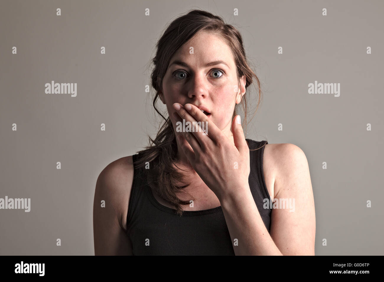 Scared young woman Stock Photo - Alamy
