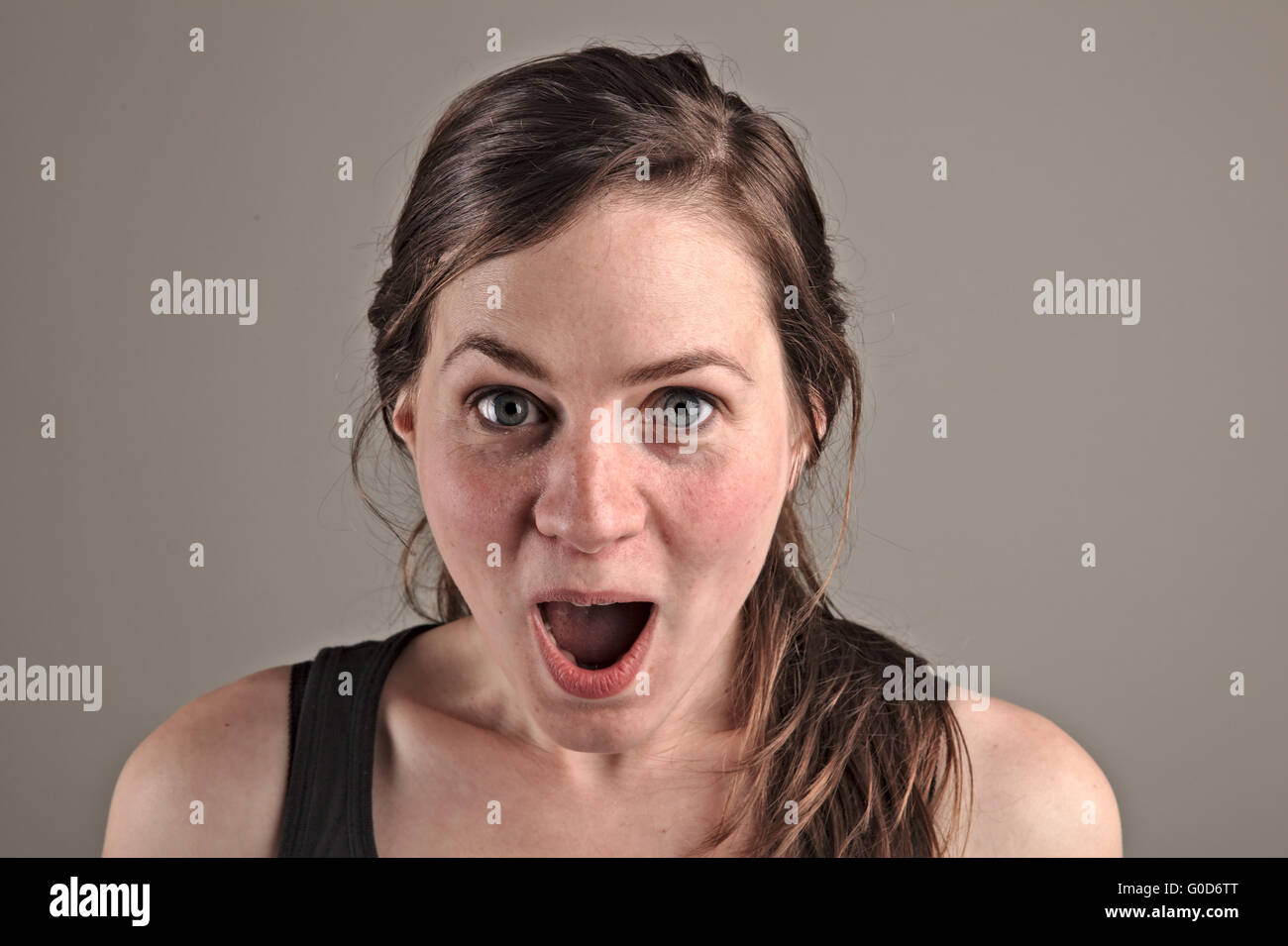 Young woman is surprised Stock Photo - Alamy