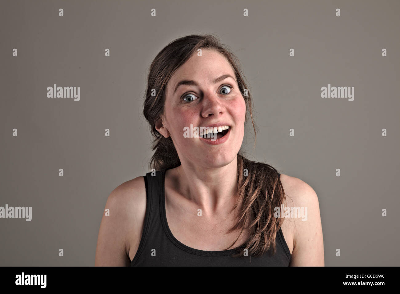 Young woman feels happy Stock Photo - Alamy