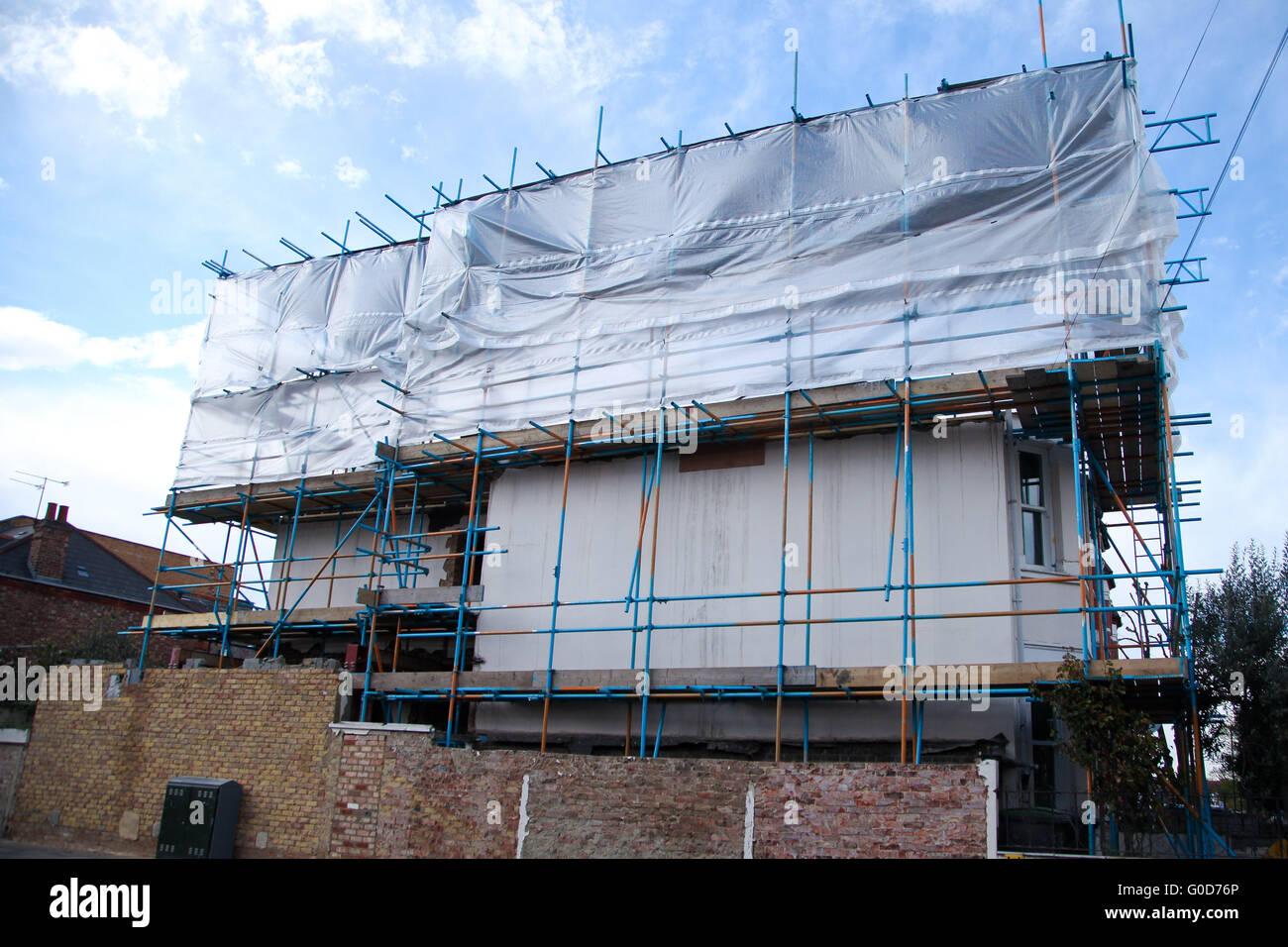 Scaffolding on a renovated house in London Stock Photo - Alamy