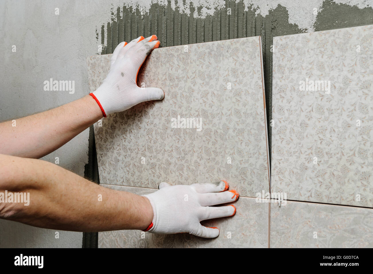 Installing ceramic floor tile hi-res stock photography and images - Alamy