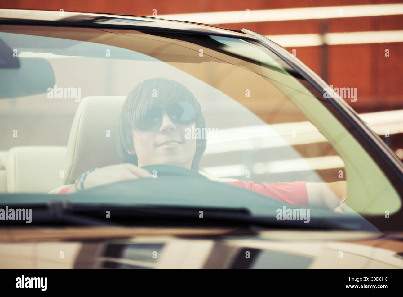 Cool guy driving convertible car hi-res stock photography and images ...