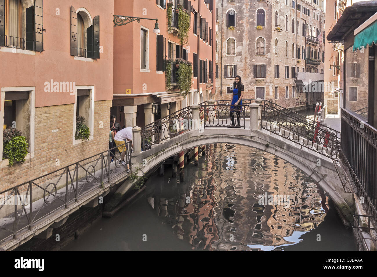 Venice lady posing by canal hi-res stock photography and images - Alamy