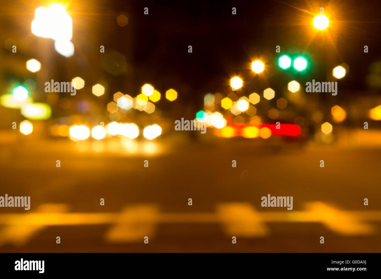 Blurry yellow evening lights as seen through abstract artistic point of ...