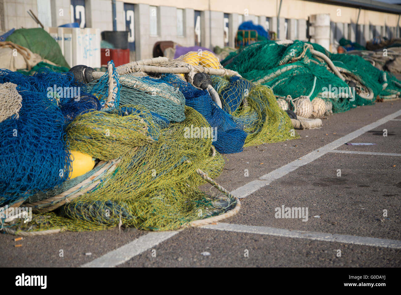 Used industrial ropes lake with fishing nets Stock Photo - Alamy