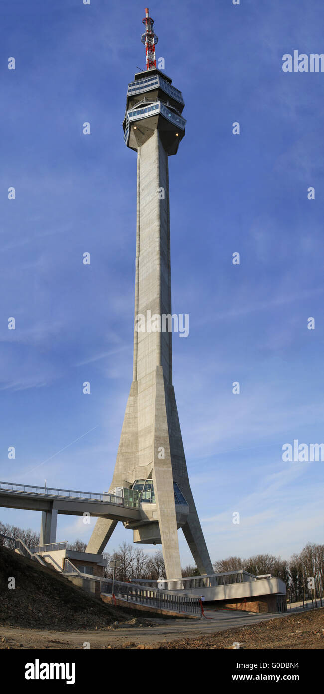 New TV tower building with communication antenna Stock Photo - Alamy