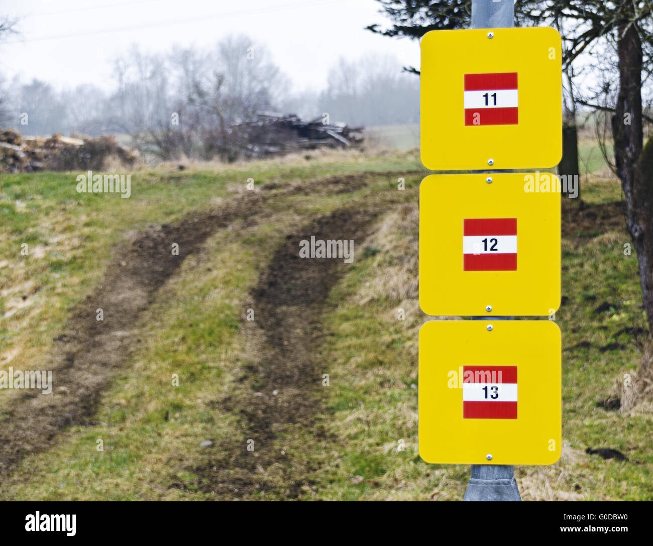 pole with yellow signs number 11, 12 and 13 Stock Photo - Alamy