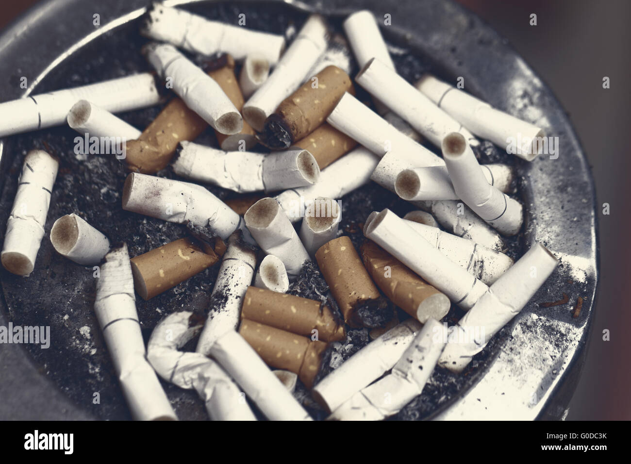 Bad addiction. Ashtray and cigarettes close-up Stock Photo - Alamy