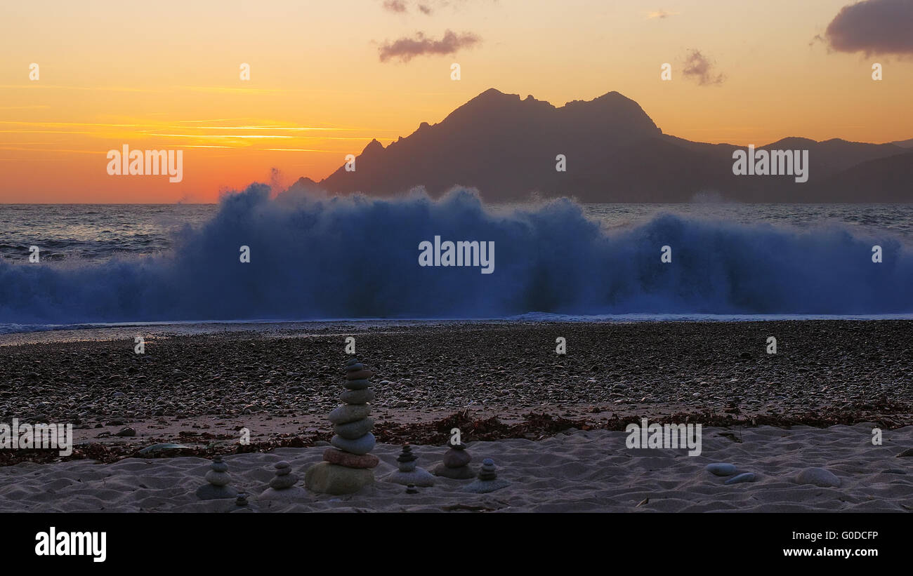 Surging billow in the afterglow at the beach Stock Photo - Alamy