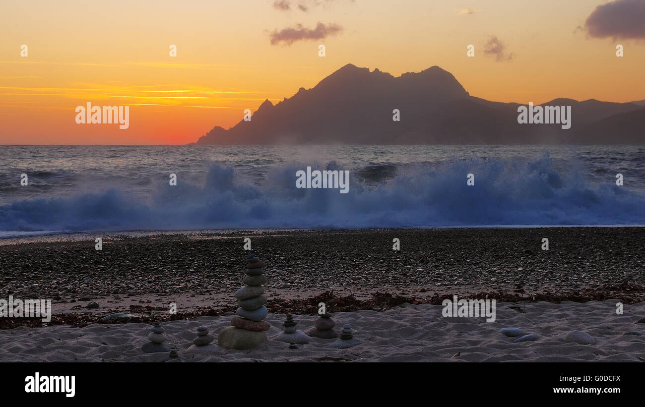 Surging billow in the afterglow at the beach Stock Photo - Alamy