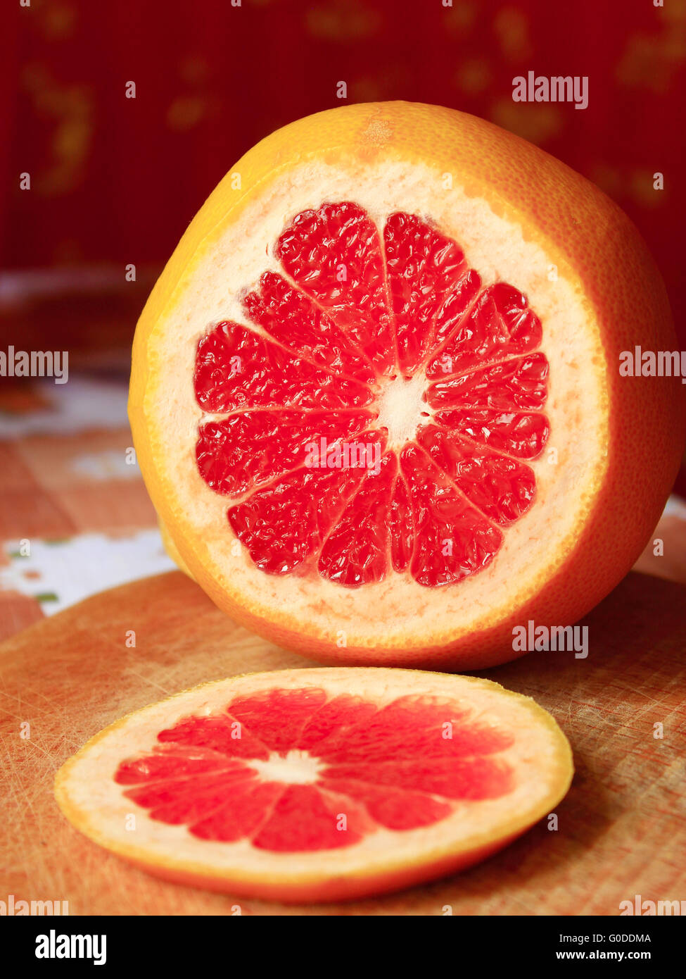 grapefruit bright red and cut by segments Stock Photo - Alamy
