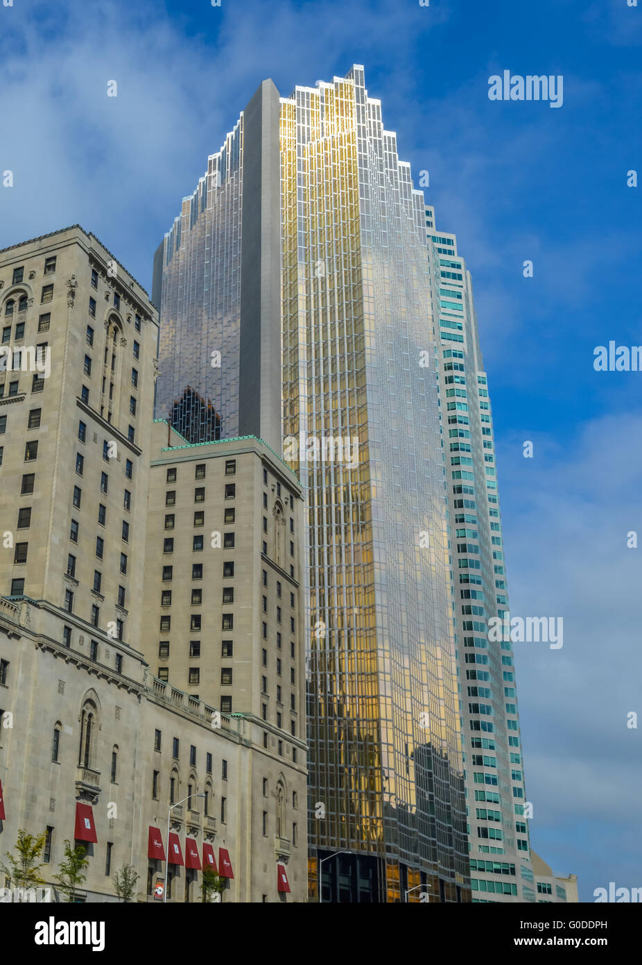 Toronto, Canada - June 13, 2015: Gold skyscraper and the old fashioned ...