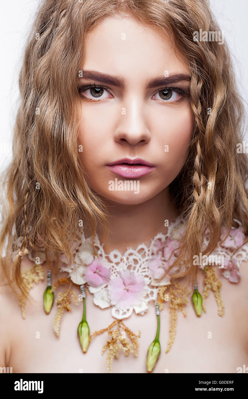 Close-up portrait of teen girl with flower necklace Stock Photo - Alamy