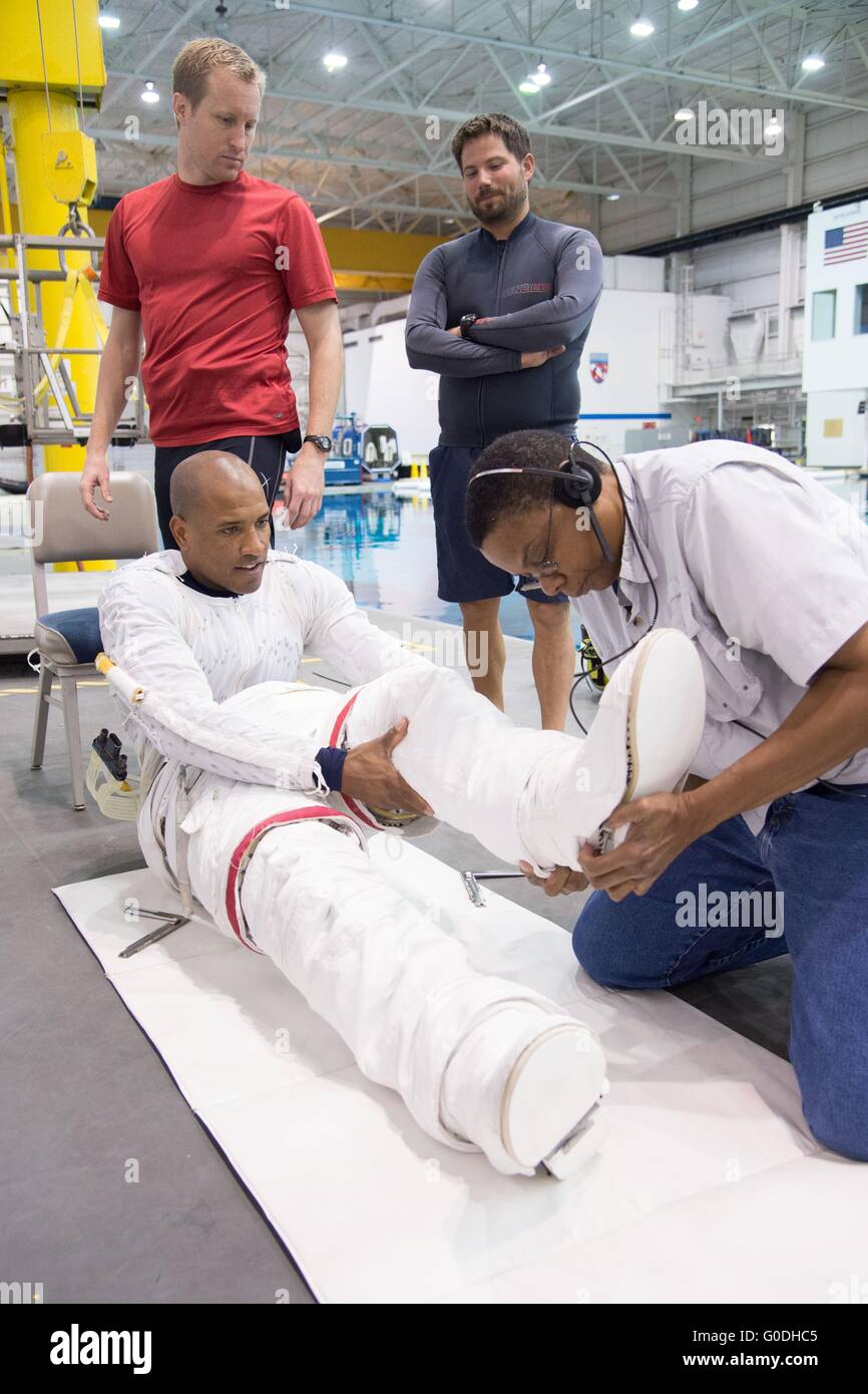 NASA astronaut Victor Glover assembles his Extravehicular Mobility Unit ...