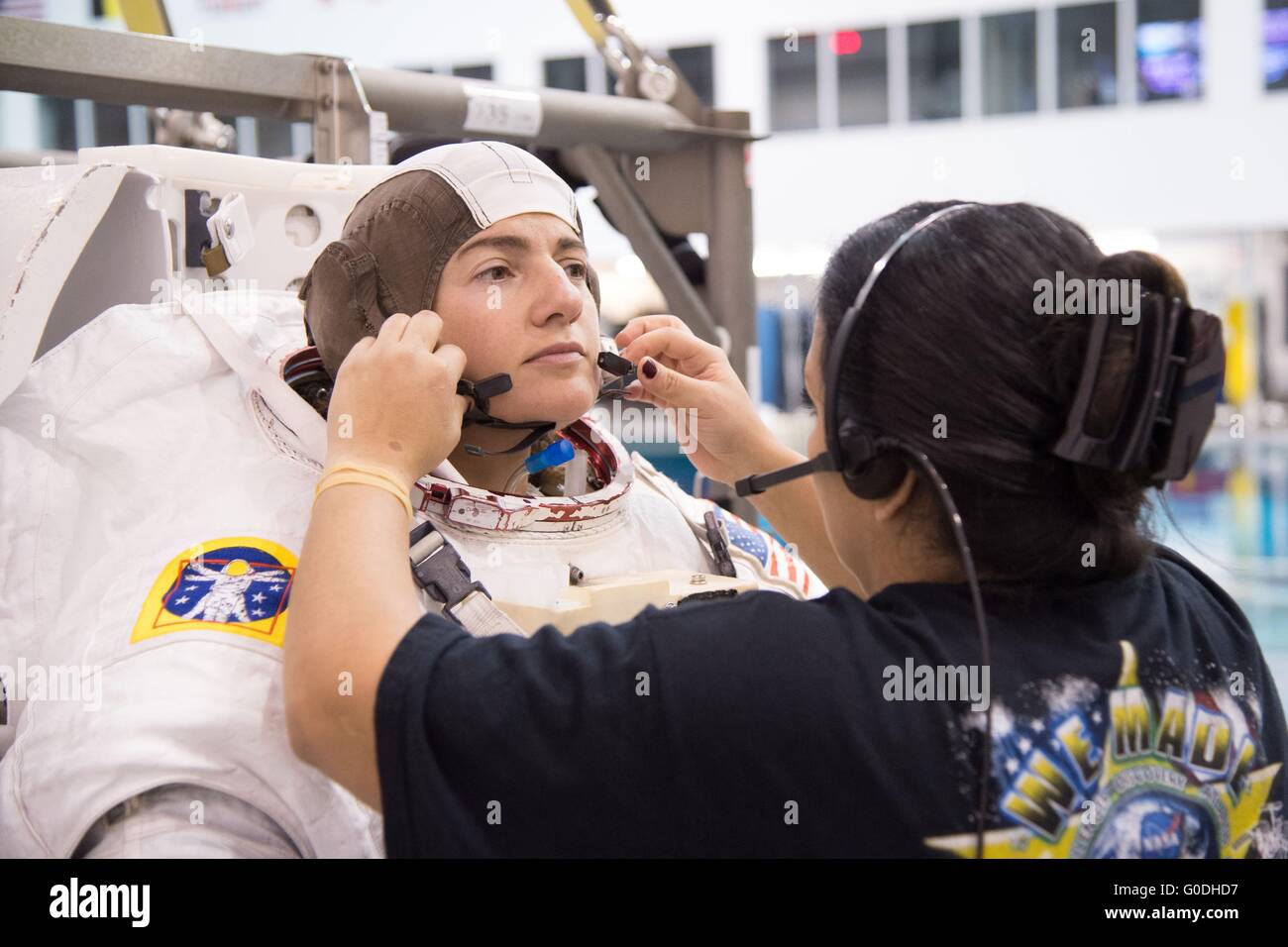 NASA astronaut Jessica Meir is assisted with her Extravehicular ...