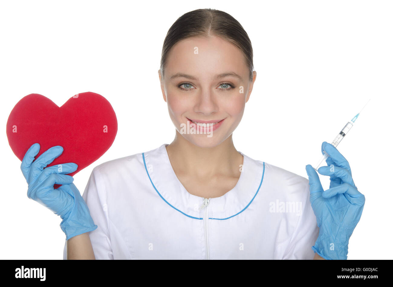 Smiling doctor shows a heart symbol and syringe Stock Photo - Alamy