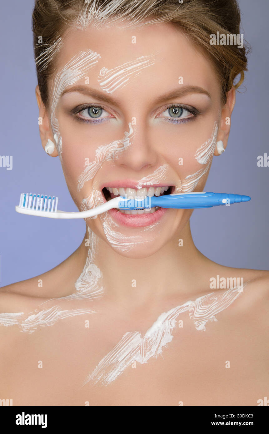 woman with toothbrush mouth and in toothpaste Stock Photo - Alamy