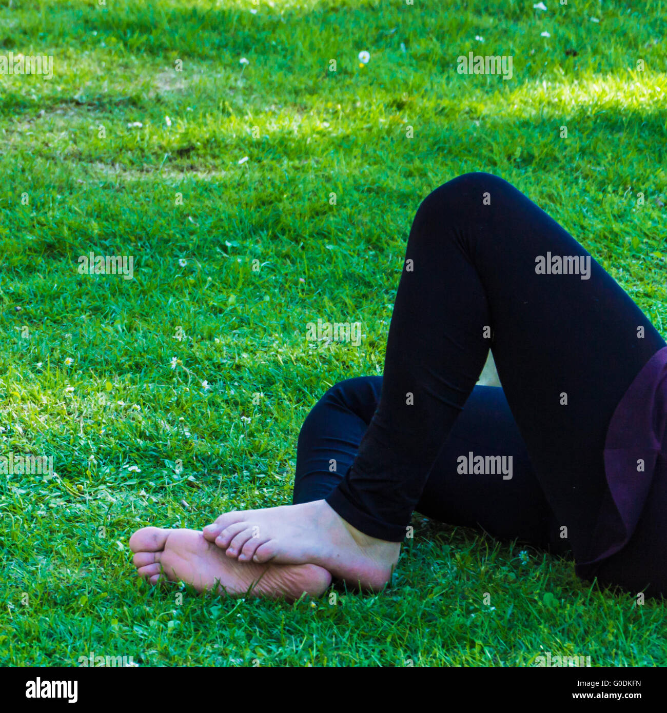Relaxed feet on green grass Stock Photo - Alamy