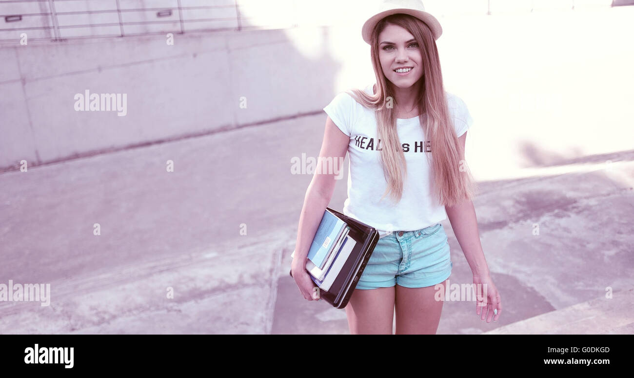 Attractive trendy young female student Stock Photo - Alamy