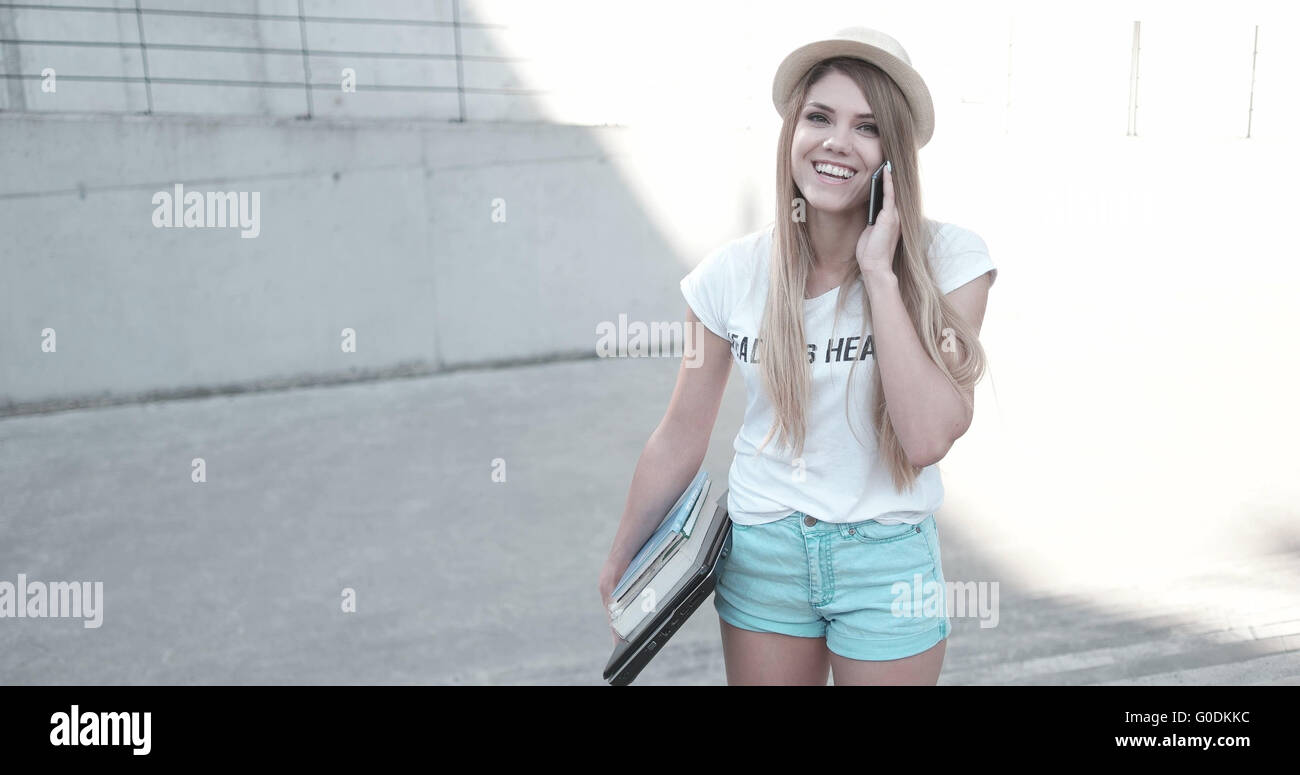 Attractive trendy young female student Stock Photo - Alamy