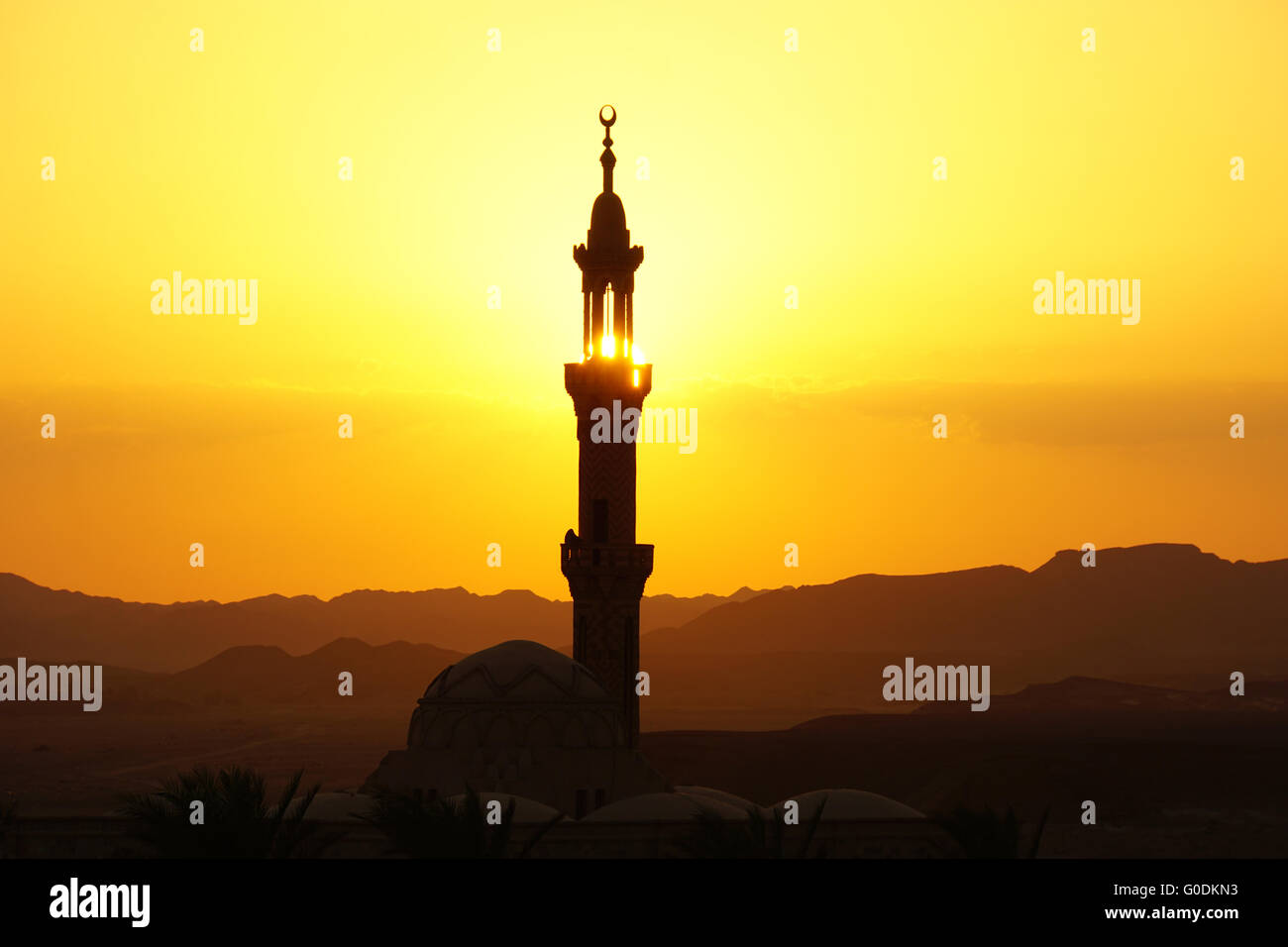sunset over mosque in egypt town of el quesir Stock Photo - Alamy