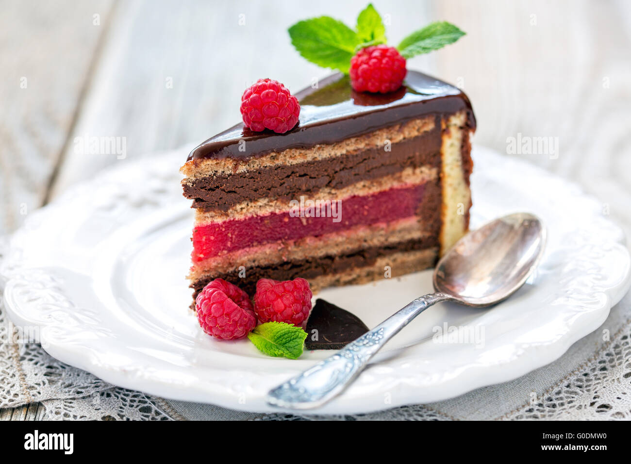 Piece of chocolate cake with raspberry jelly Stock Photo - Alamy
