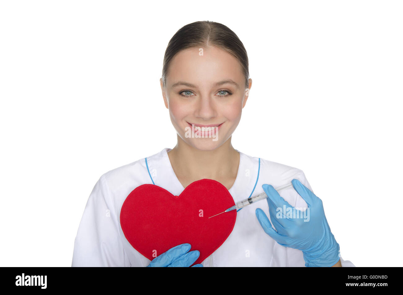 Smiling doctor with a syringe pricks heart symbol Stock Photo - Alamy