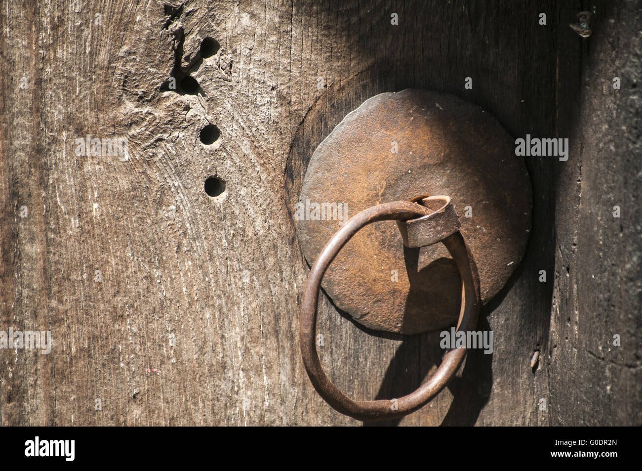 Rusty iron fittings hardware of old weathered door Stock Photo - Alamy