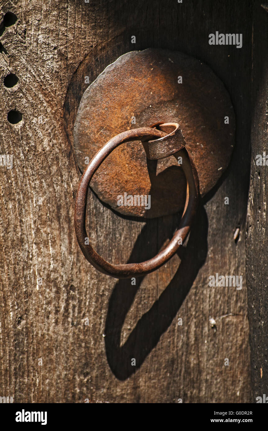 Rusty iron fittings hardware of old weathered door Stock Photo - Alamy