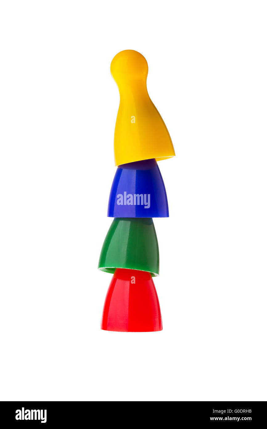 Four different colored game pawns Stock Photo - Alamy