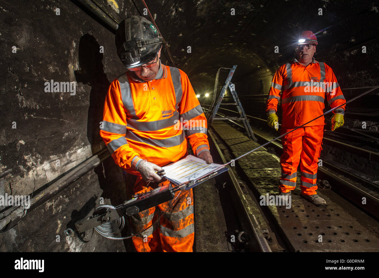Maintenance workers working on Glasgow Underground Stock Photo - Alamy