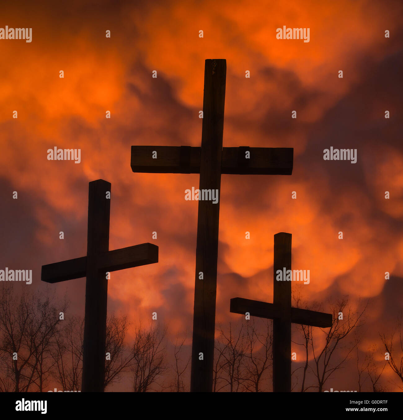 three crucifixes and mammals clouds Stock Photo - Alamy