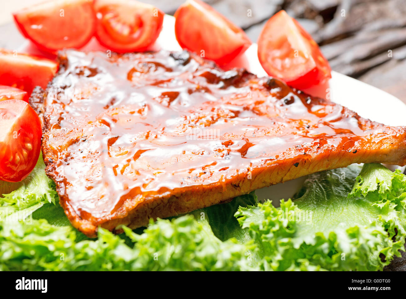 Delicious barbecued ribs seasoned with a spicy basting sauce Stock ...