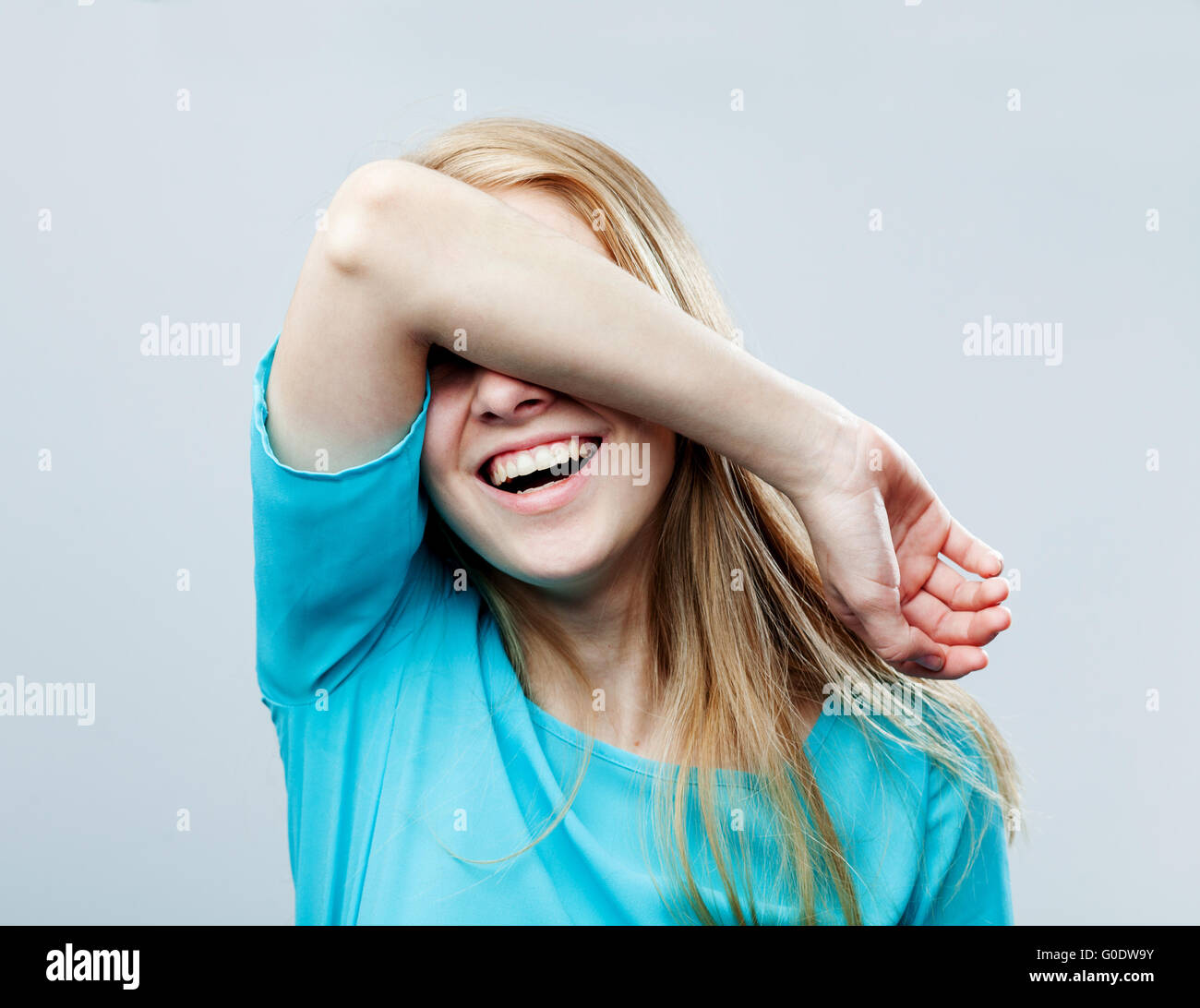 girl with hands over head Stock Photo - Alamy