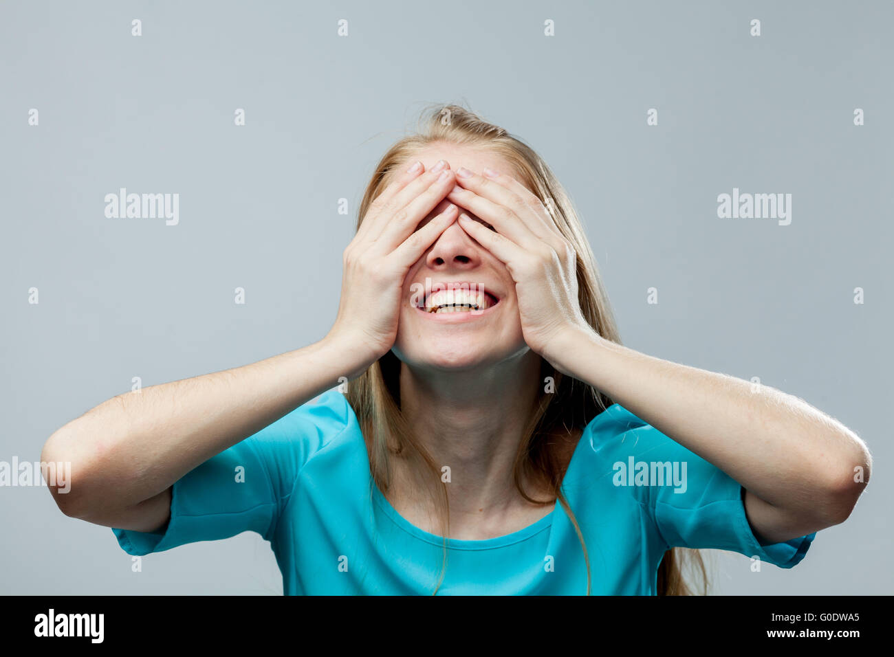girl with hands over head Stock Photo - Alamy