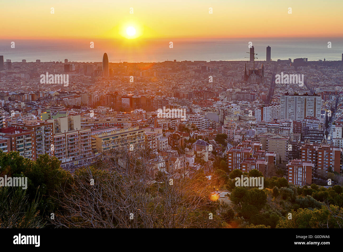 The sun rises over Barcelona in Spain Stock Photo - Alamy