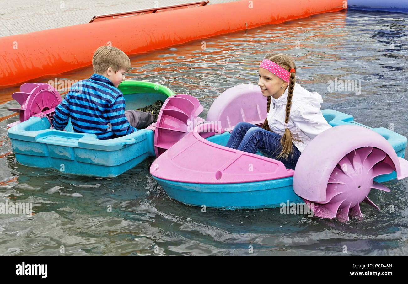 Children playing on a boat attraction Stock Photo - Alamy
