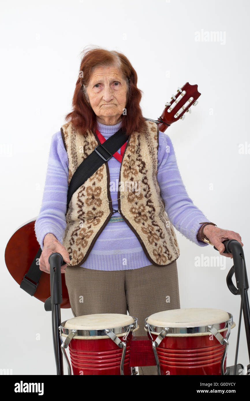Elderly lady with rollator and musical instruments Stock Photo - Alamy
