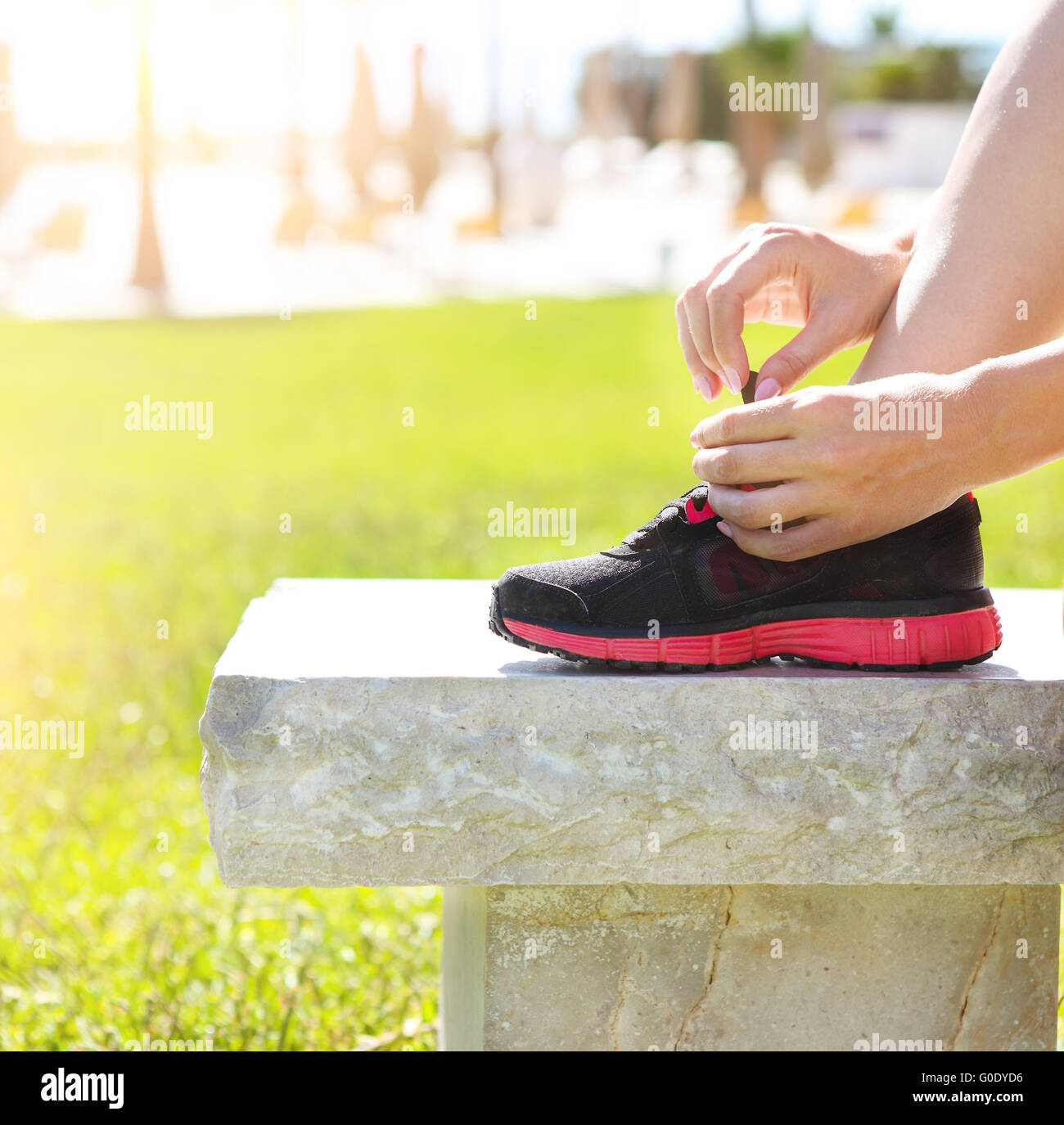 Athlete girl trying running shoes getting ready for jogging Stock Photo ...